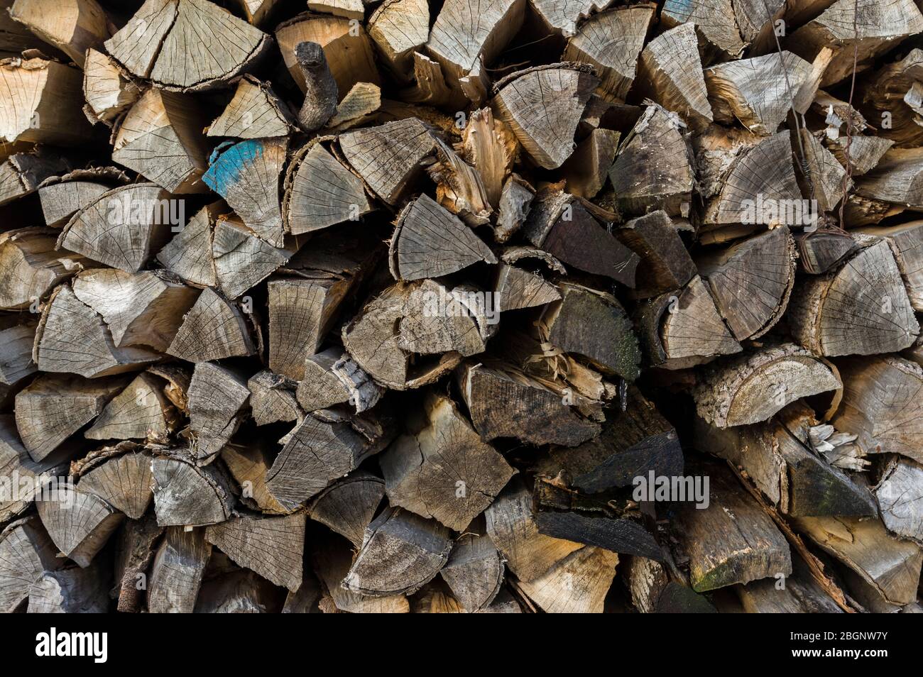 Wood stack of neatly stacked firewood and small wood to dry for ...