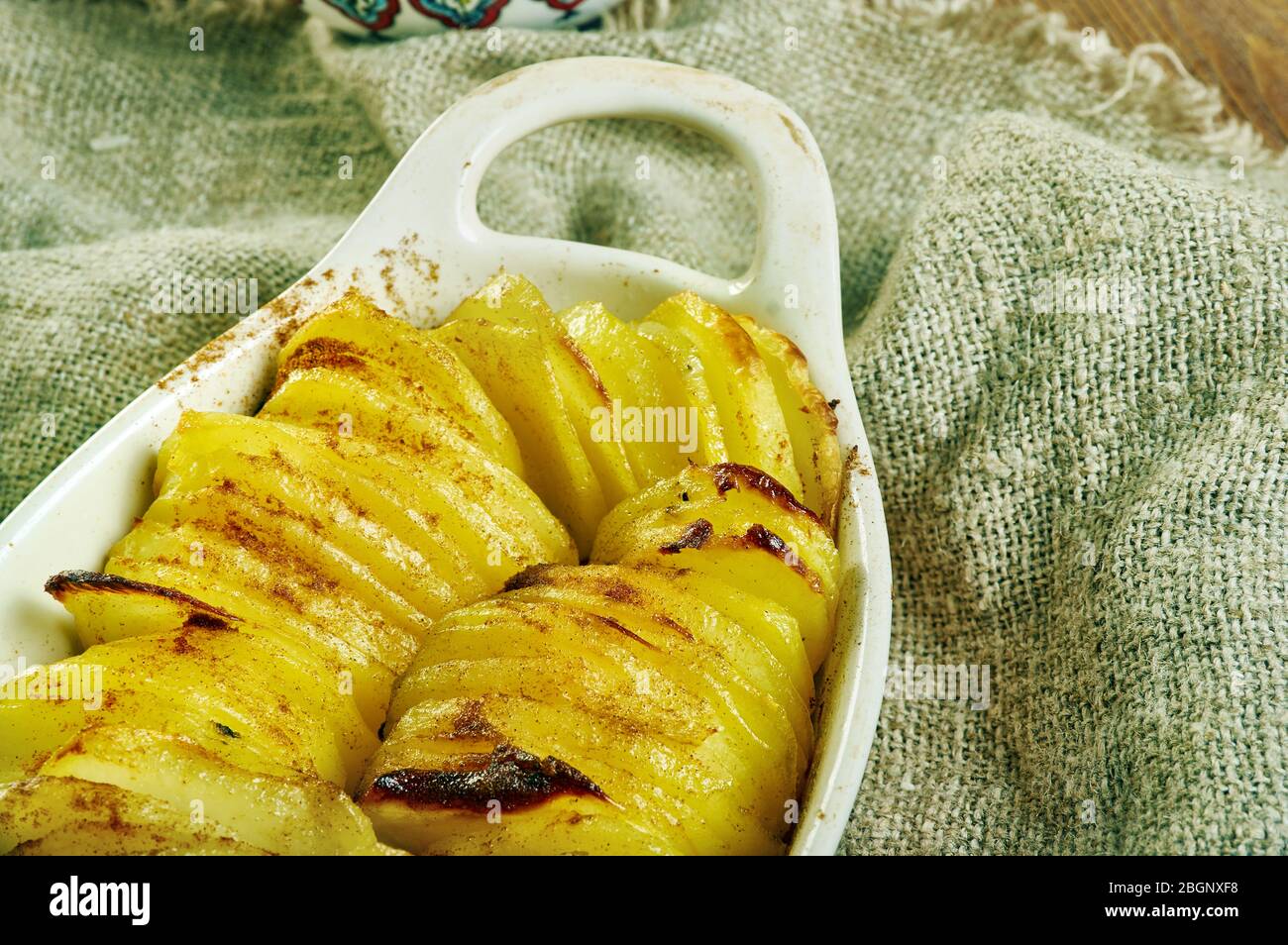 Crispy Leaf Potatoes -Best Roasted Potatoes Ever, sliced potatoes in a ...