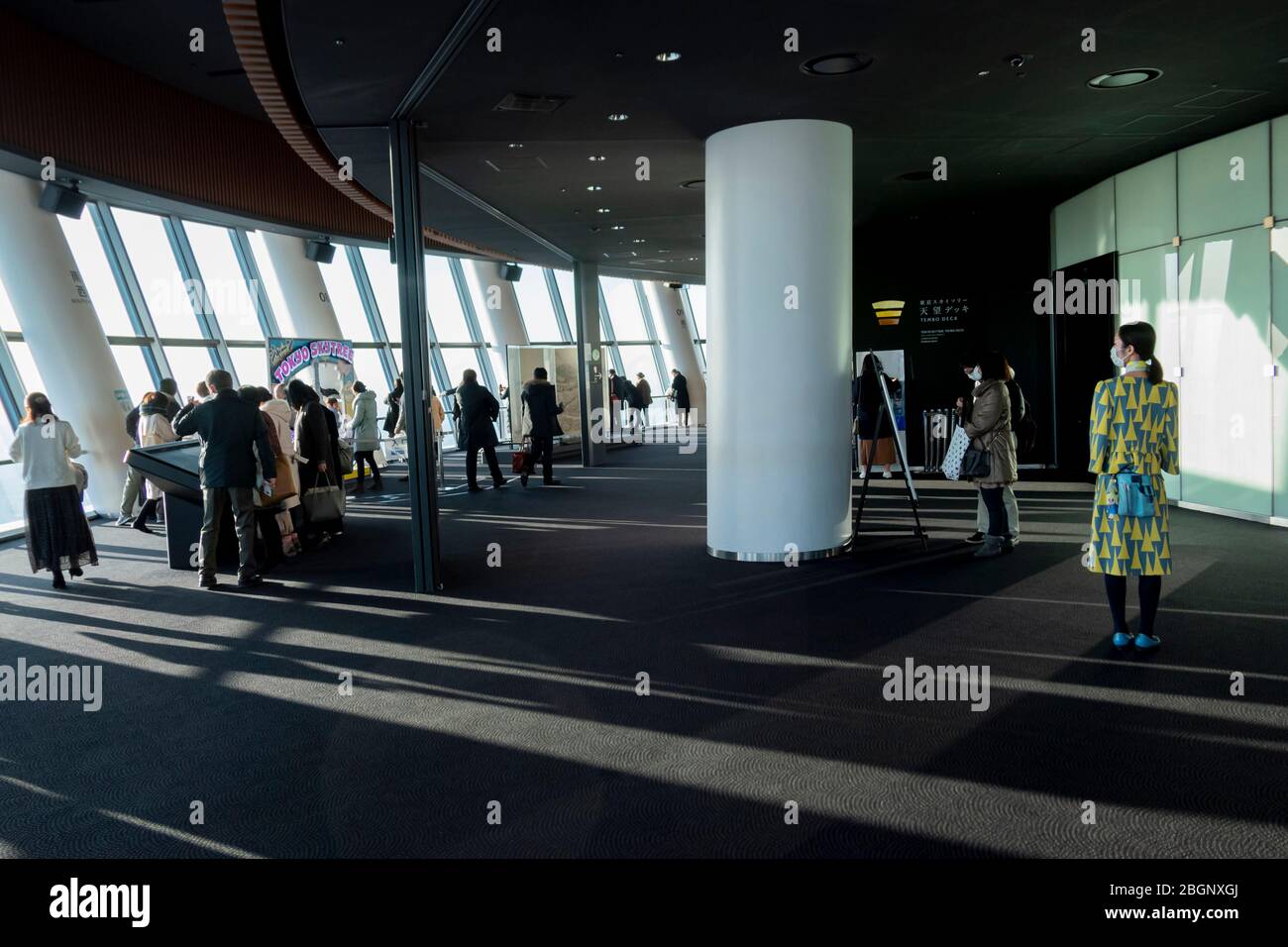 The silhouette photo of tourists in the Tokyo Sjytree dock who are look ...