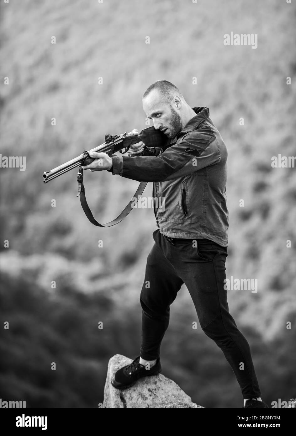 Hunter poacher looking for victim. Hunter with rifle nature environment ...