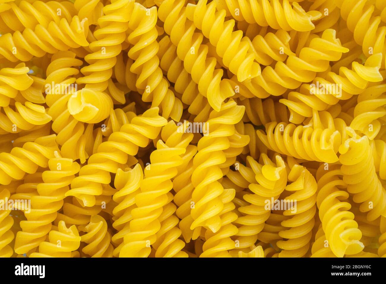 Fusilli helix shaped Macaroni Pasta raw food background or texture ...