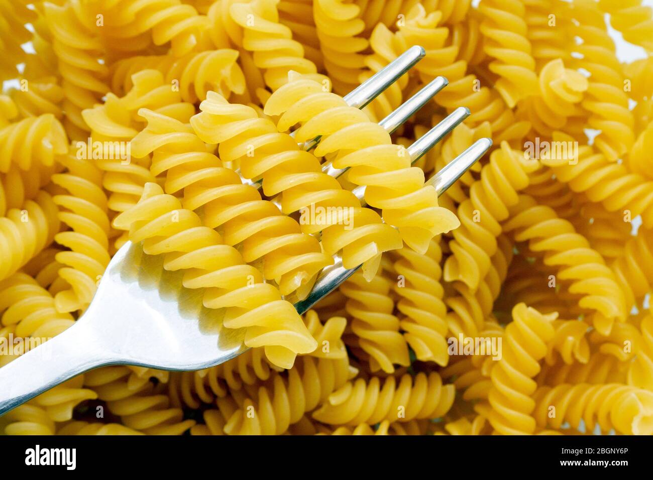 Fusilli helix shaped Macaroni Pasta raw food background or texture ...