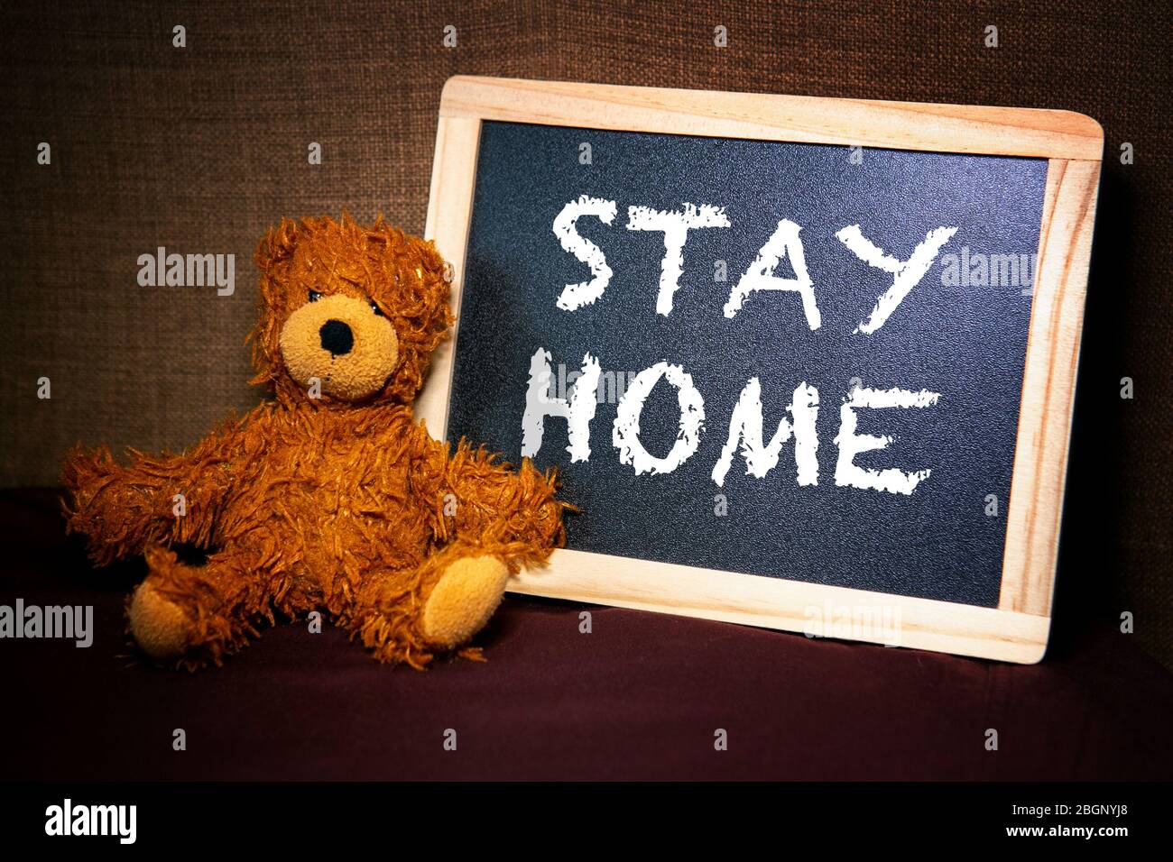 teddybear with chalkboard and the words Stay Home Stock Photo - Alamy