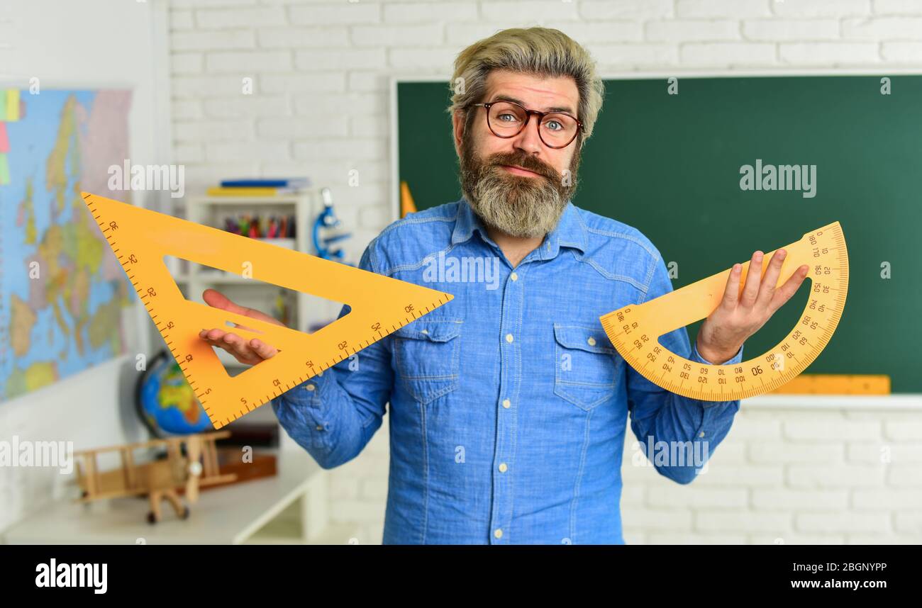 Man mentoring school projects. Math subject. Geometry and algebra ...