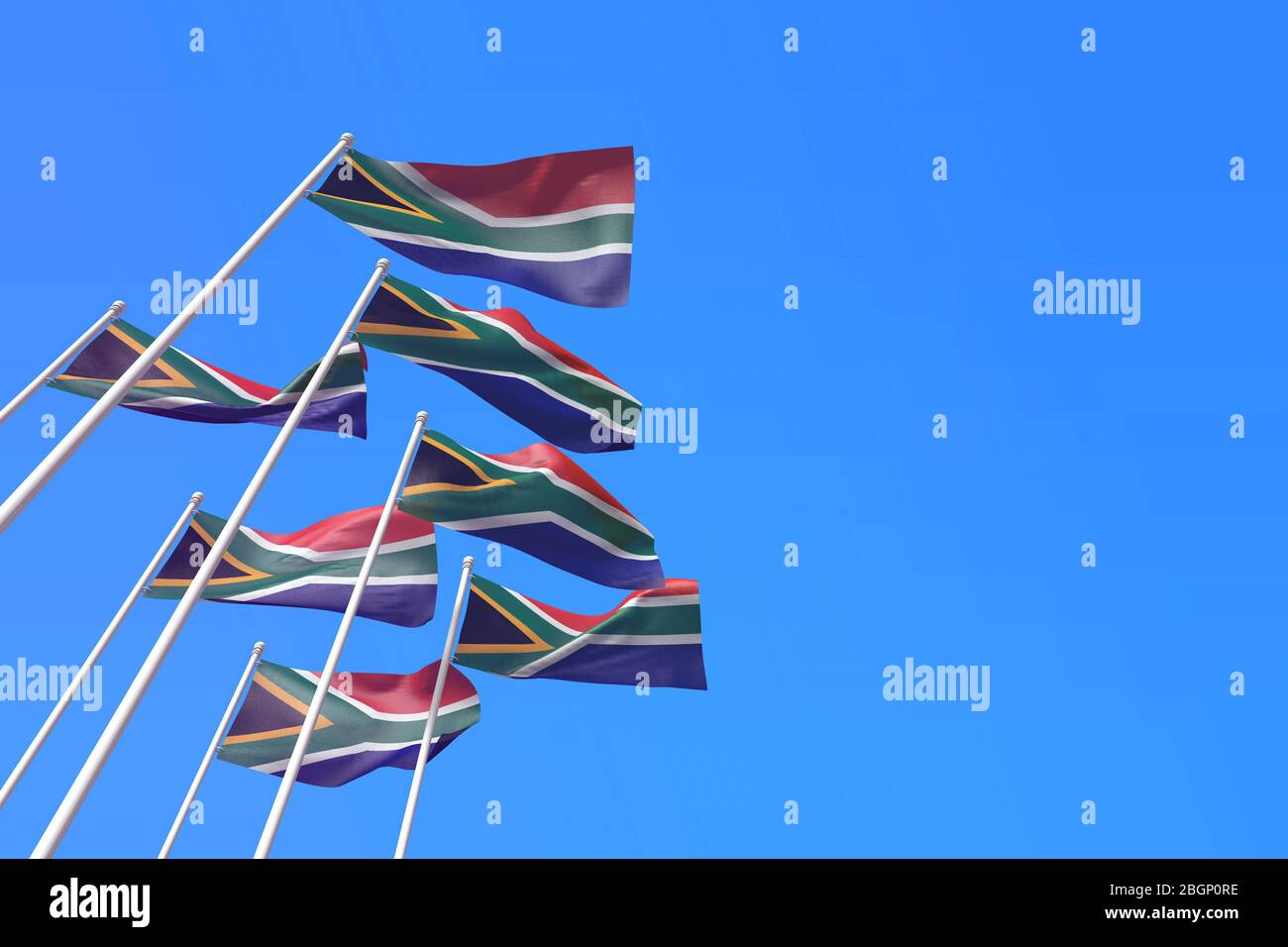 South Africa flags waving in the wind against a blue sky. 3D Rendering ...