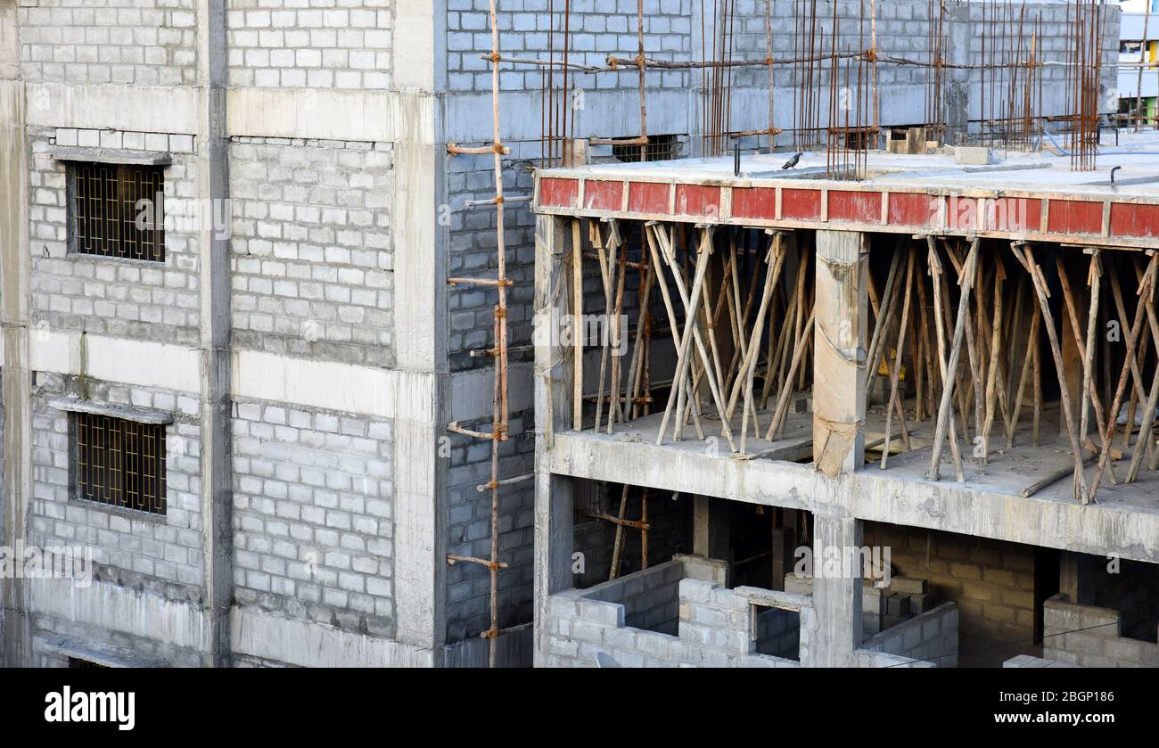 Building under construction in a city Stock Photo - Alamy