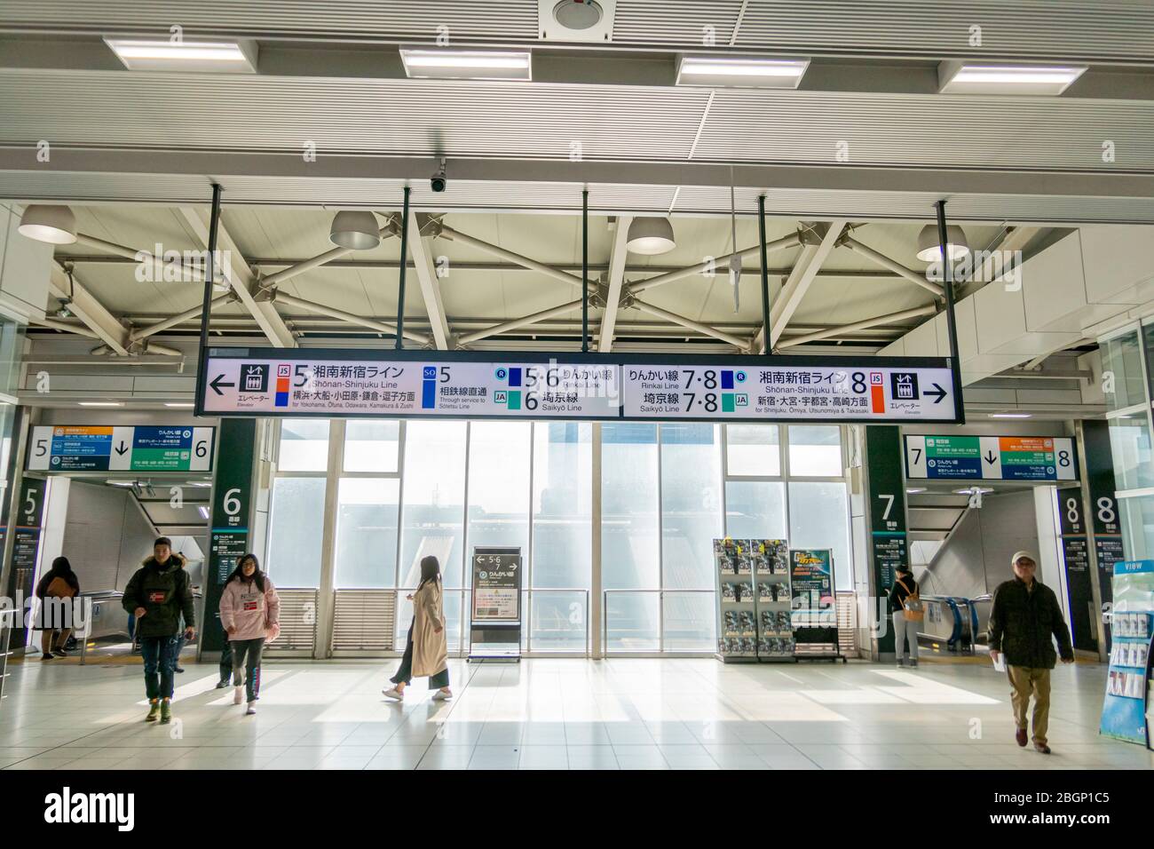 Japanese people walking to the train gate with the entrance number at ...
