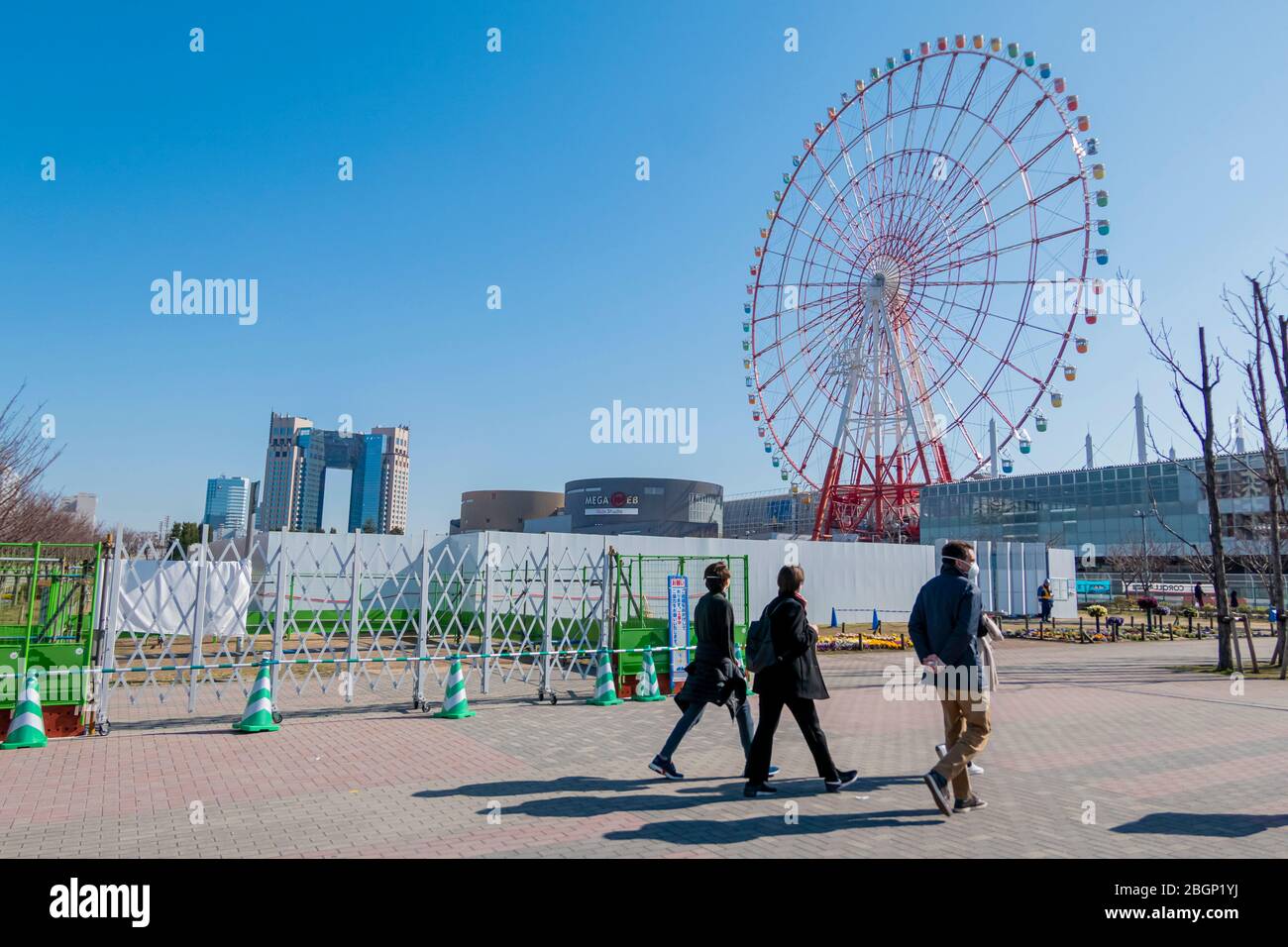 Japanese people wearing mask while walking at Daiba seaside park ...