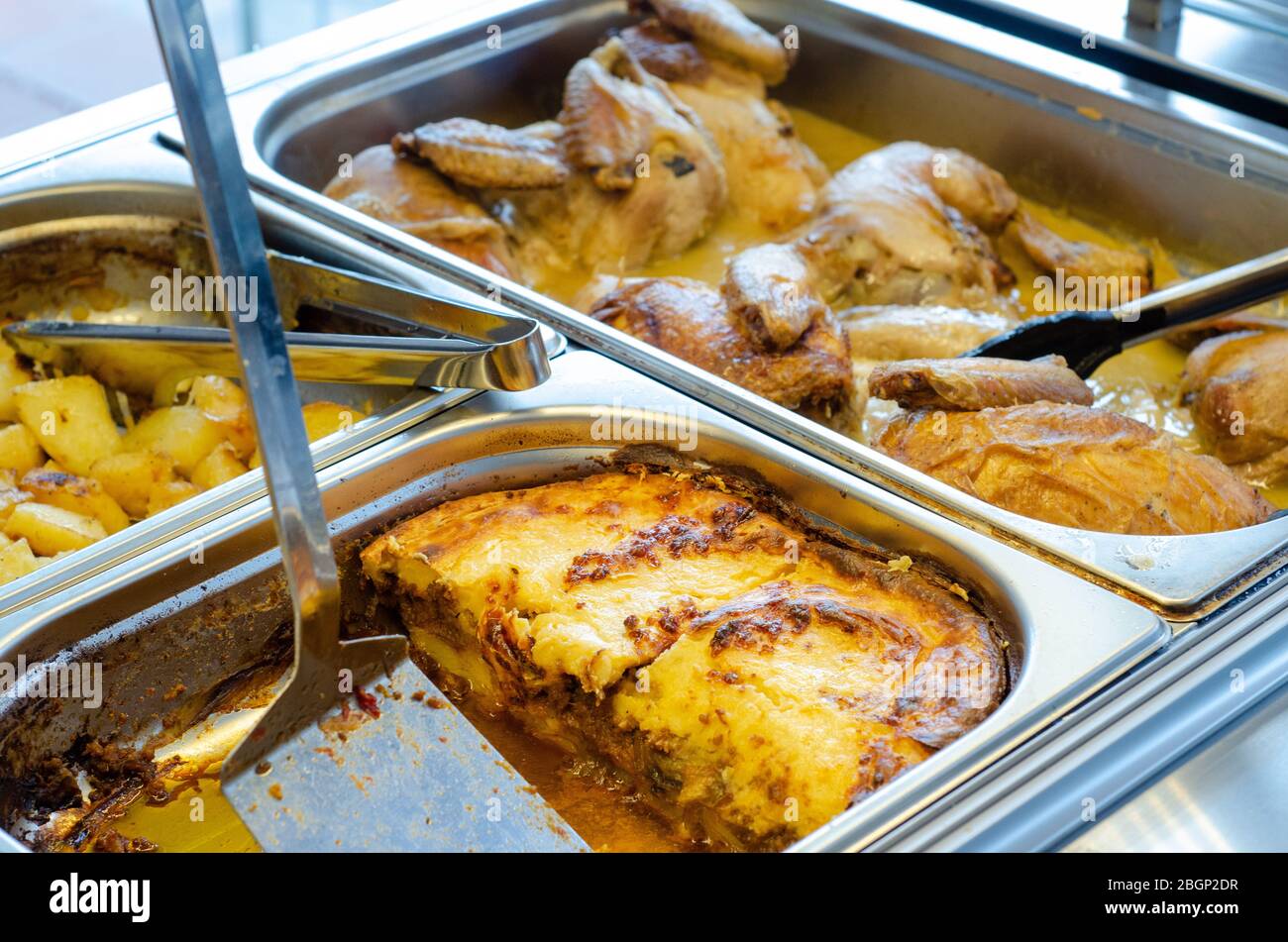 buffet bain marie catering mousakas pottato and chiken containers Stock ...