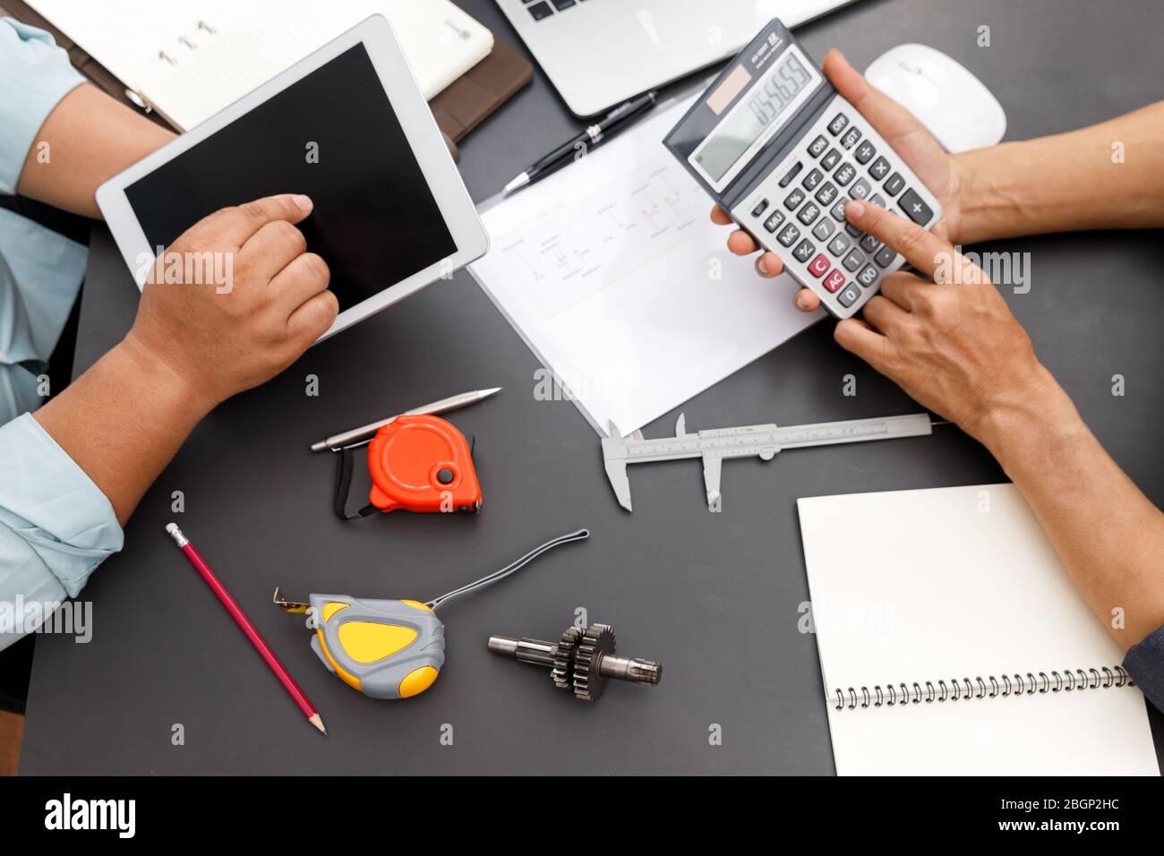 The engineering team is working on their project together Stock Photo ...