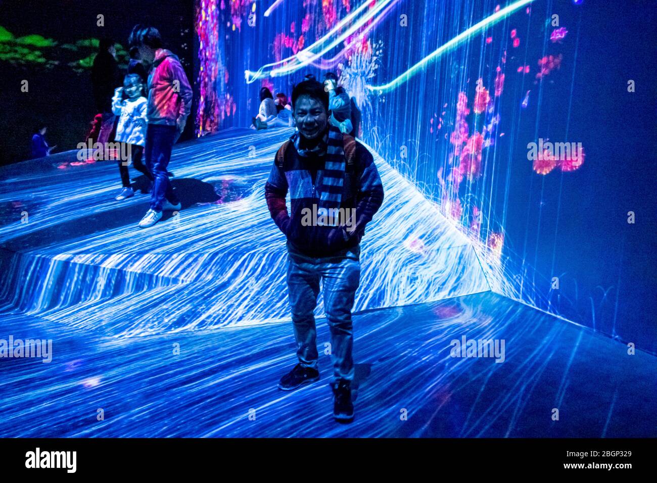 Interactive light effect as the waterfall and river at teamLab ...