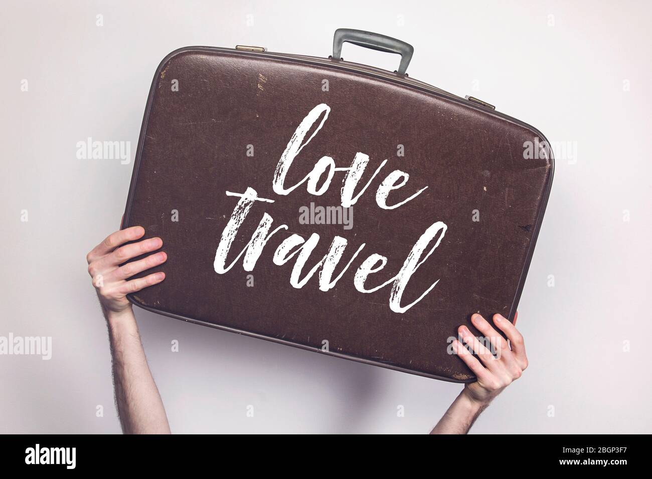 Love travel message on a vintage travel suitcase Stock Photo - Alamy