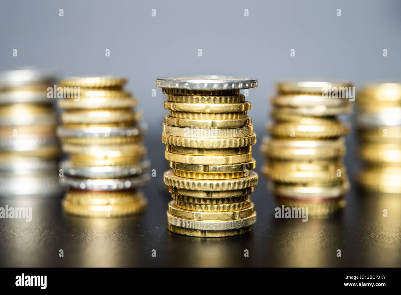 Euro coins on dark table Stock Photo - Alamy