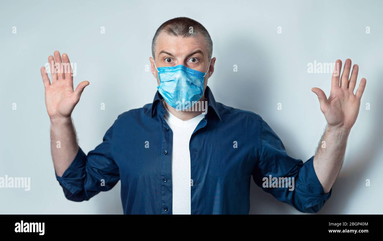 Man In Mask Raising Hands Posing On Gray Background, Panorama Stock ...