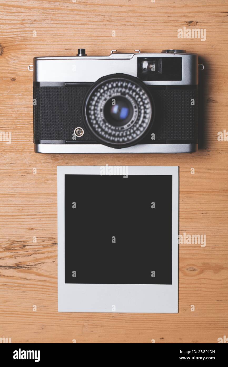 vintage retro camera with a blank instant photograph frame Stock Photo ...