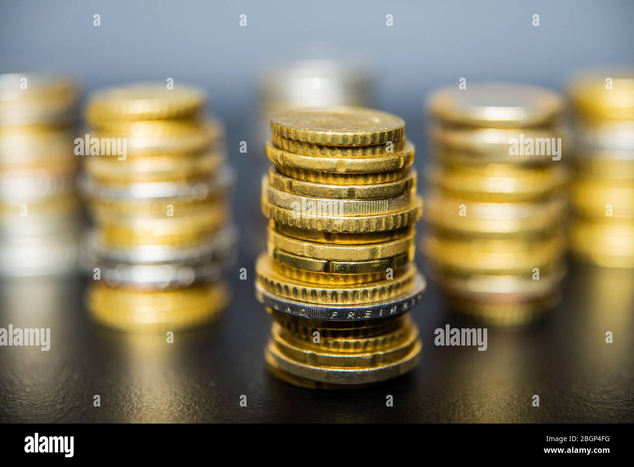 Euro coins on dark table Stock Photo - Alamy