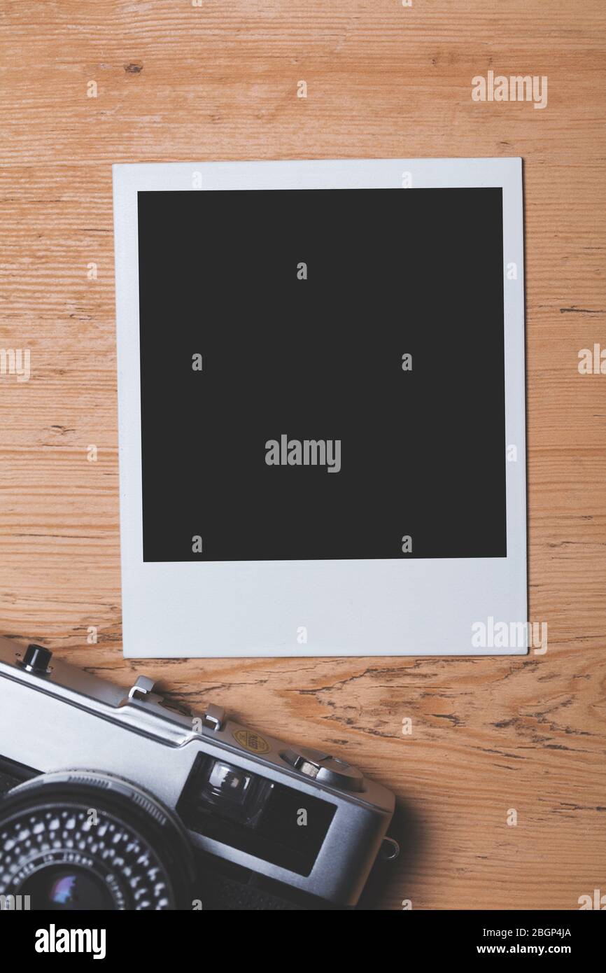 vintage retro camera with a blank instant photograph frame Stock Photo ...