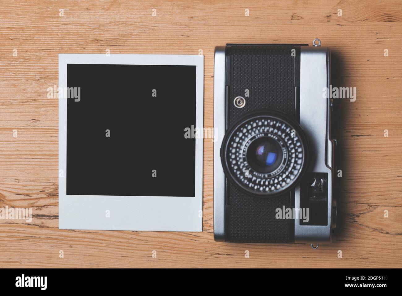 vintage retro camera with a blank instant photograph frame Stock Photo ...