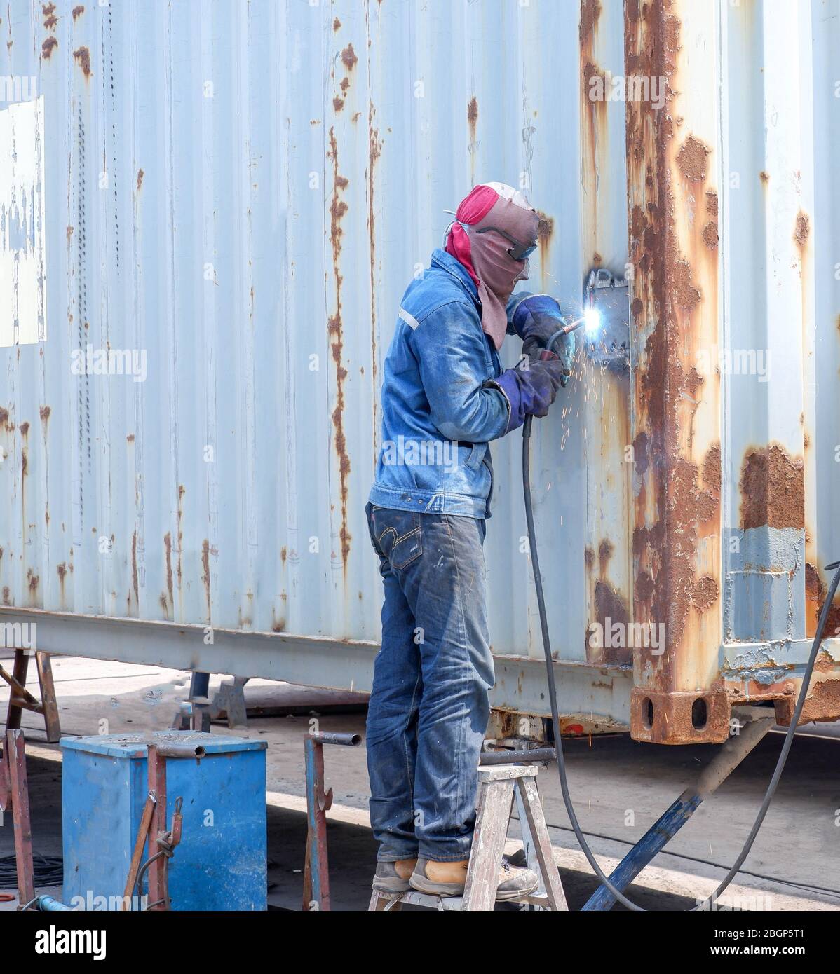 Container Welder and Repair Damage from packing Stock Photo - Alamy