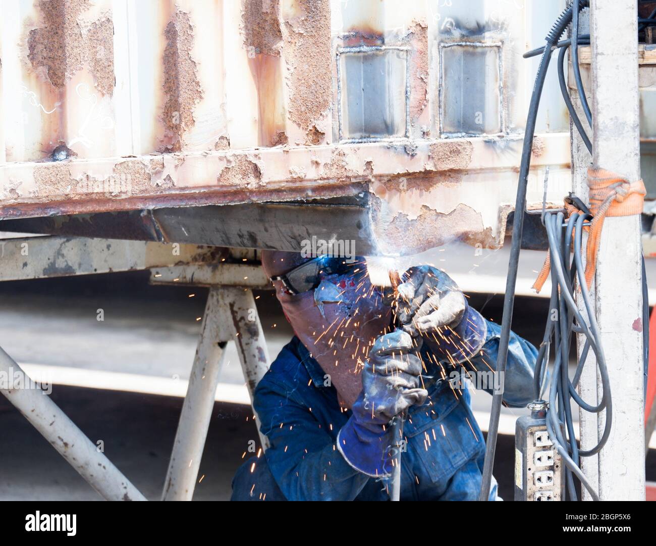Container Welder and Repair Damage from packing Stock Photo - Alamy
