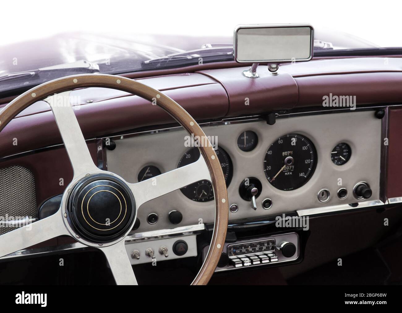 Dashboard of an old classic car with round measuring instruments and ...