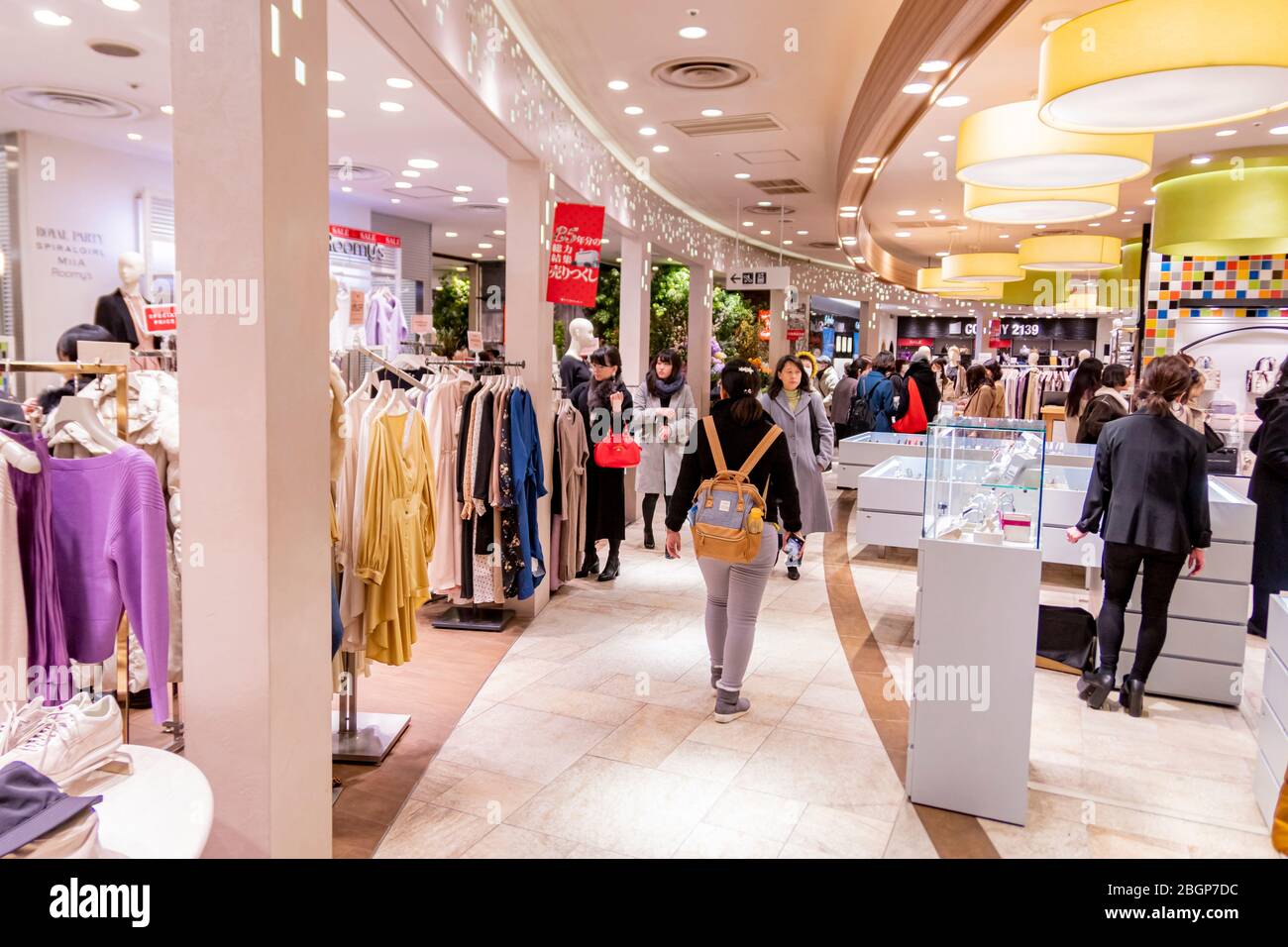 Japanese woman is choosing some clothing to buy at the Tokyu department ...