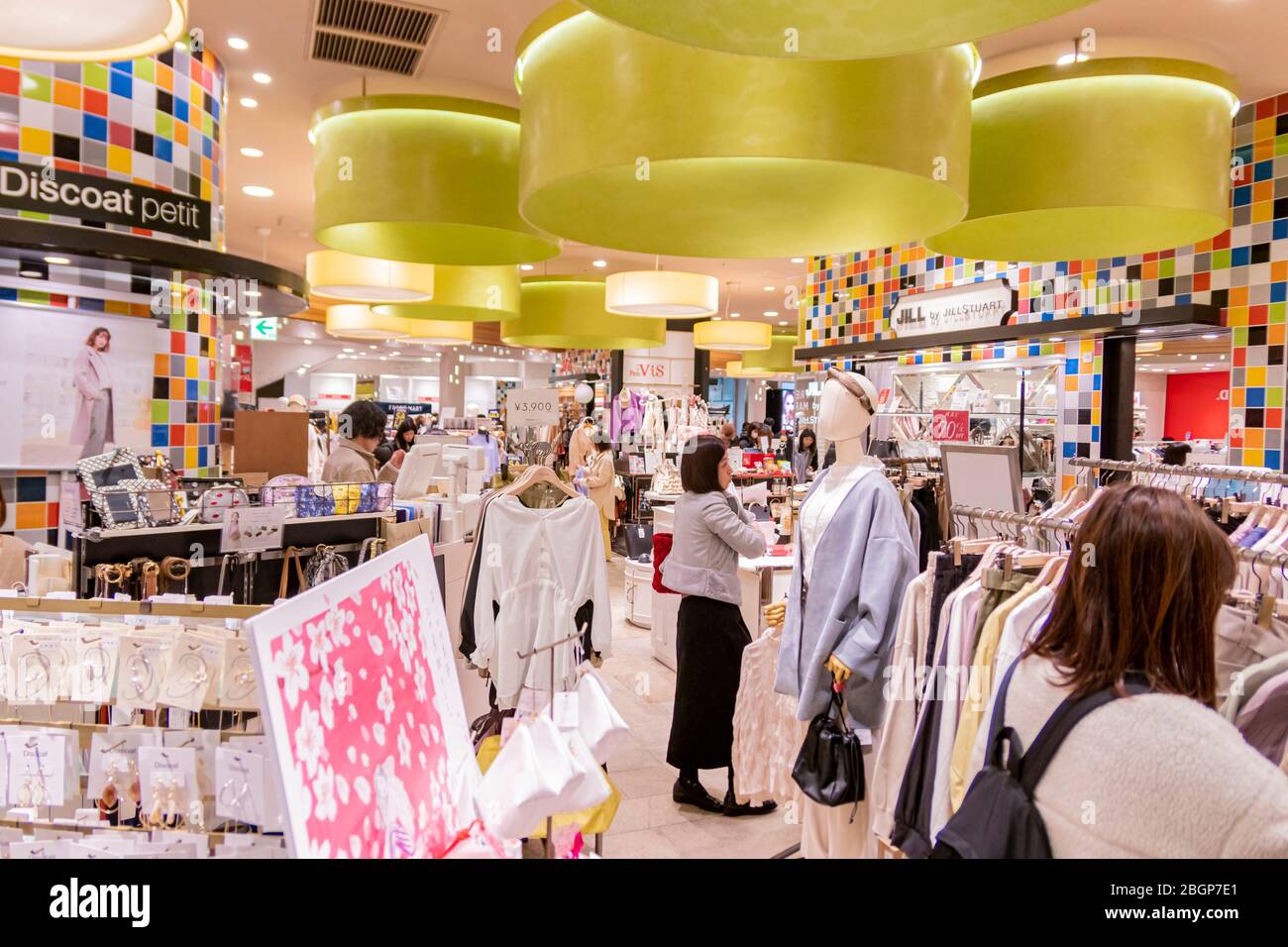 Japanese woman is choosing some clothing to buy at the Tokyu department ...