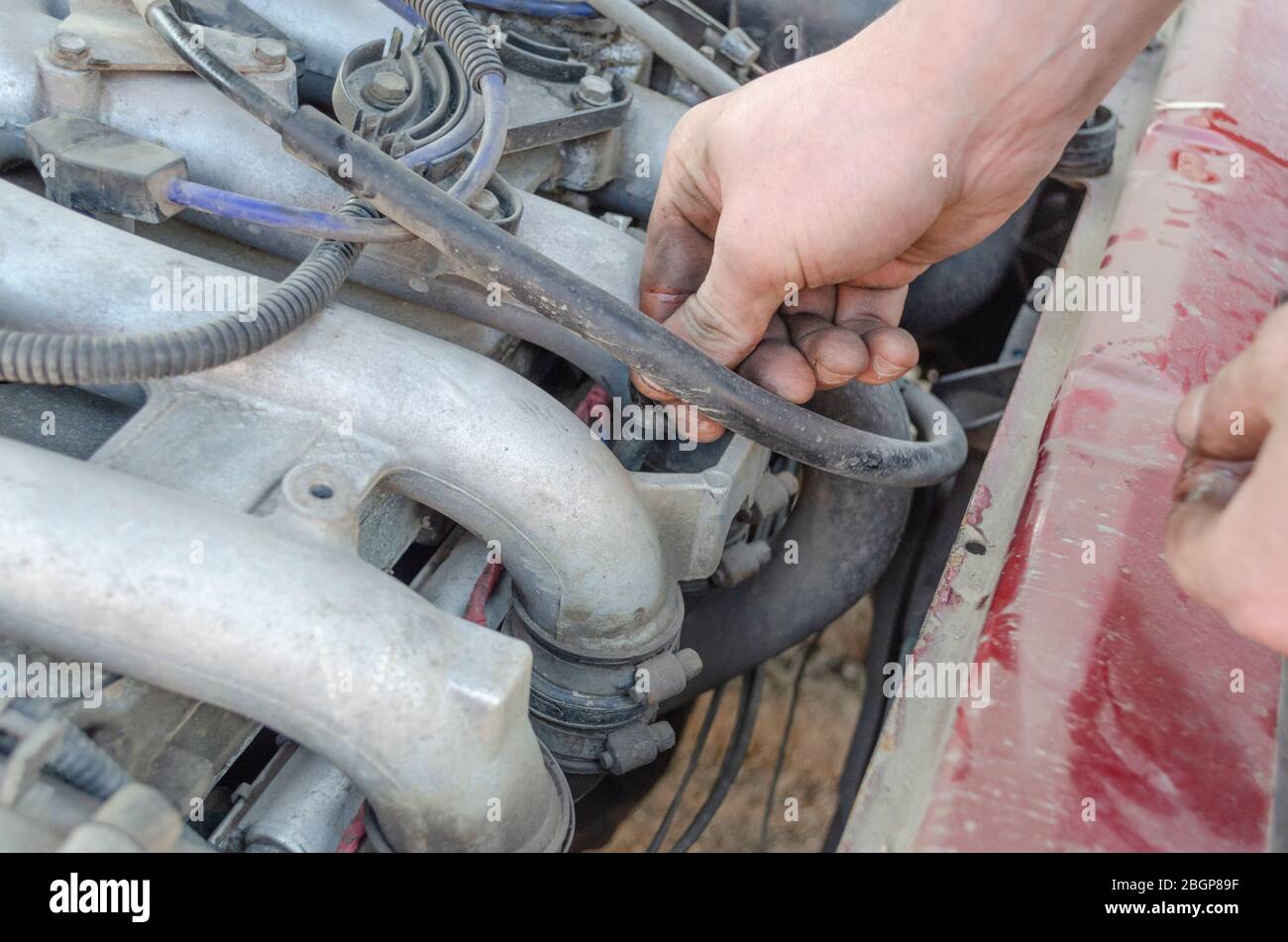 Car repair. Changing engine oil in a car Stock Photo - Alamy