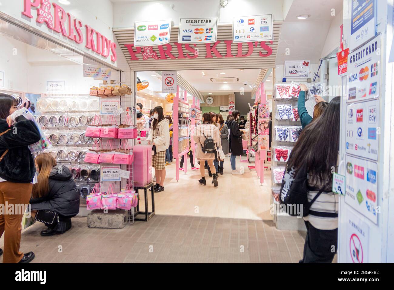 Japanese woman is choosing some clothing to buy at the Tokyu department ...