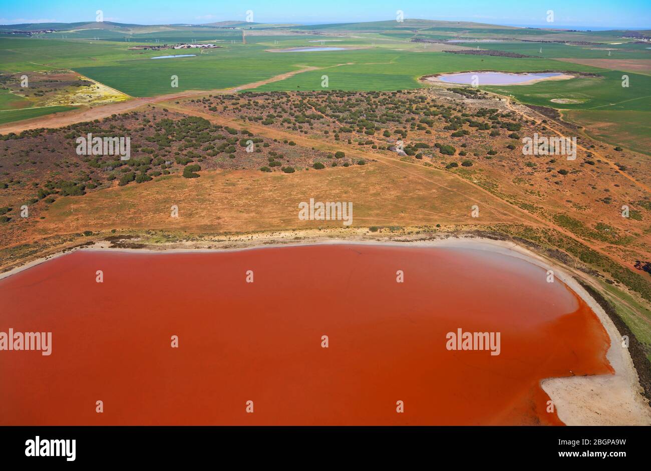 Aerial view of a re dam with green fields Stock Photo - Alamy