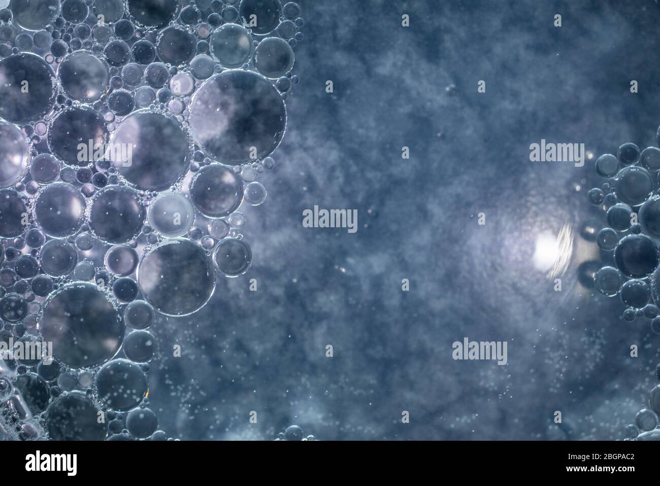 Oil droplets on a water surface Stock Photo - Alamy