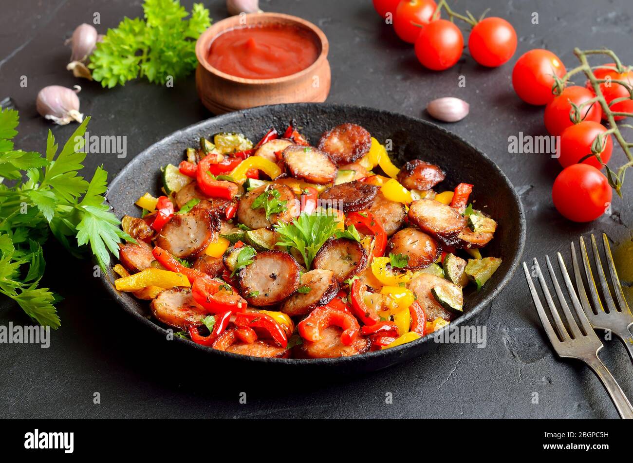 Fried sausages in pan hi-res stock photography and images - Alamy