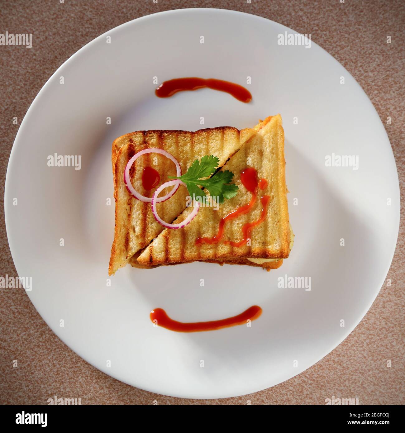 A sandwich in a white ceramic plate Stock Photo - Alamy