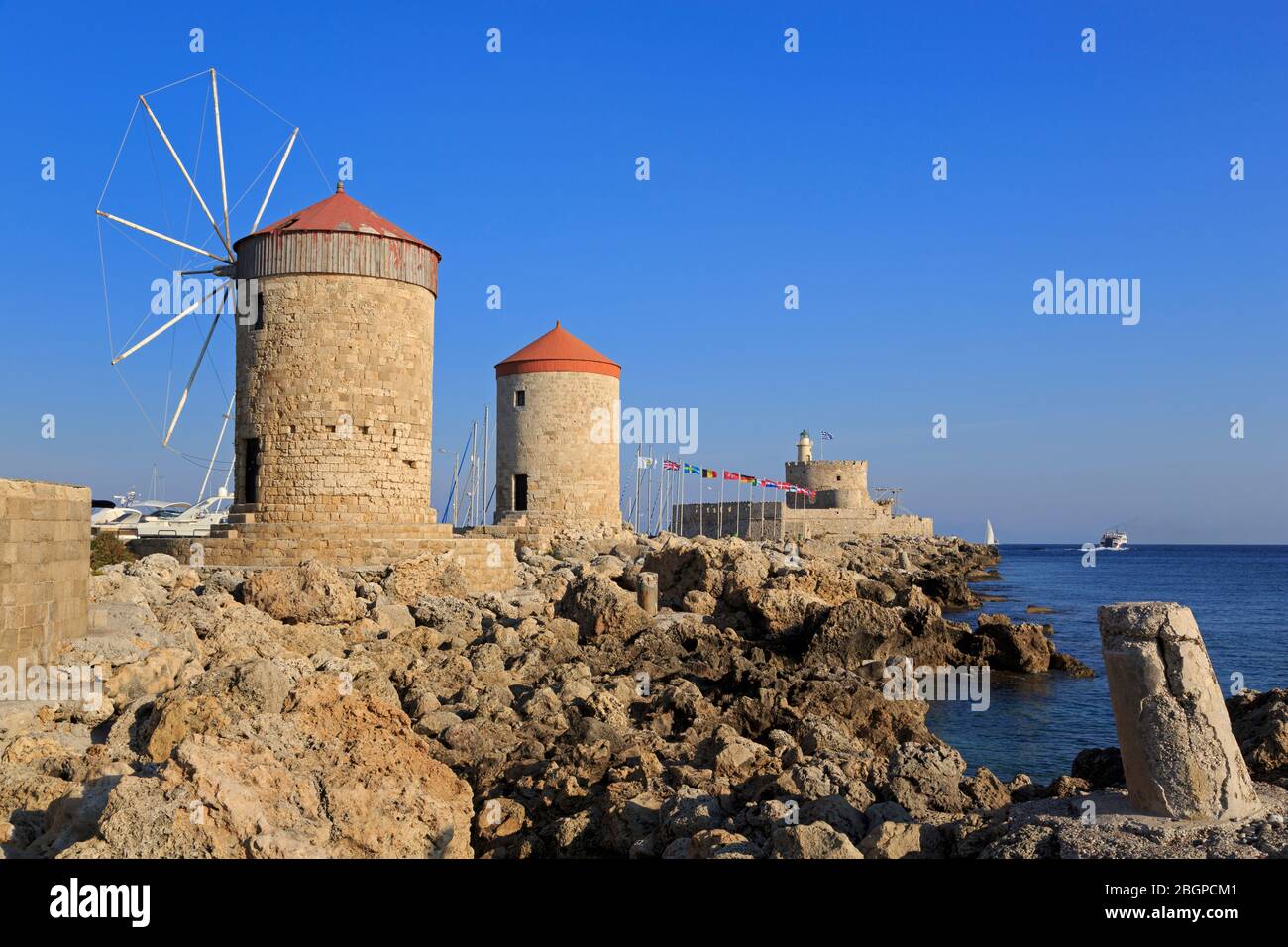 Windmills in Mandraki Harbor, Port of Rhodes, Greece, Europe Stock ...