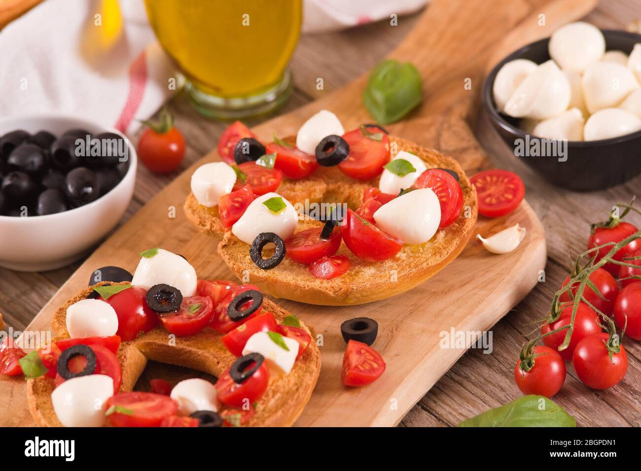 Friselle with tomatoes and mozzarella cheese Stock Photo - Alamy