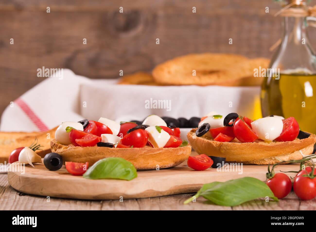 Friselle with tomatoes and mozzarella cheese Stock Photo - Alamy