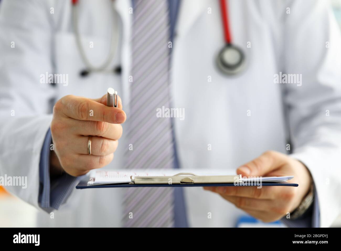 Doctor giving patient documents hi-res stock photography and images - Alamy