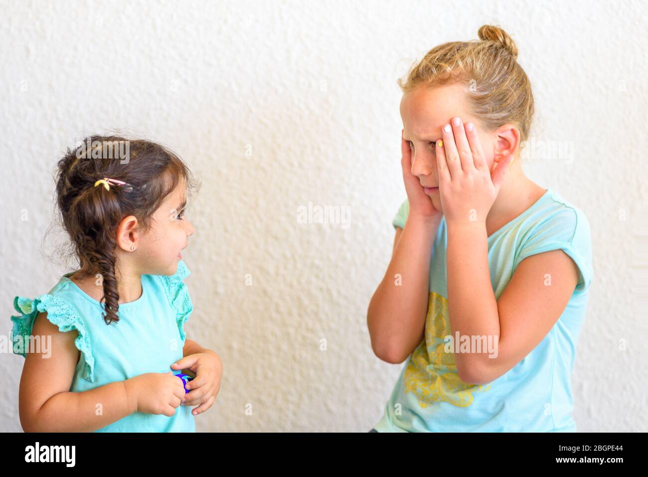 News, fake news, gossip concept. Shocked teenager girl and her toddler ...