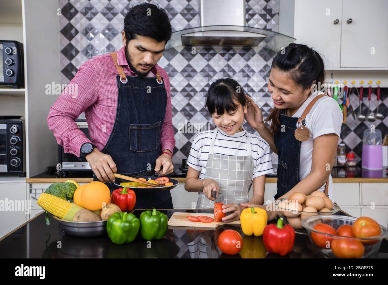 Asian families are cooking and parents are teaching their daughters to ...