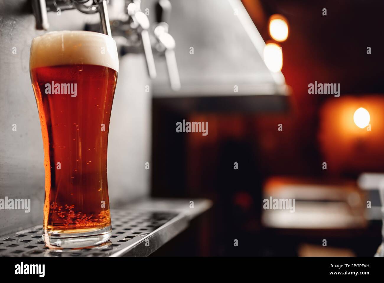 Beer taps raw in pub. Selective focus, dark background Stock Photo - Alamy