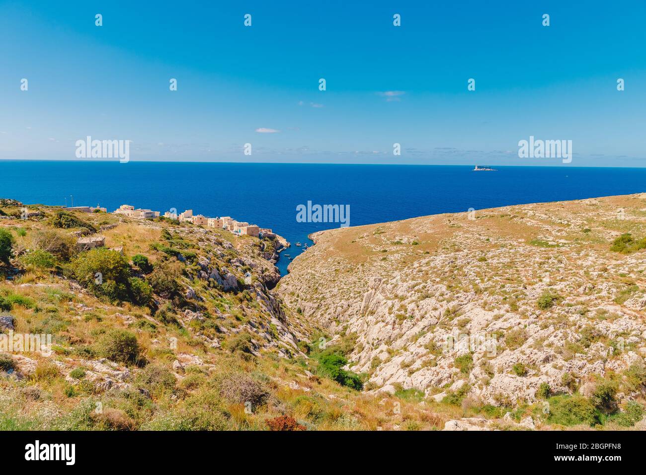 Blue Grotto in Malta. Pleasure boat with tourists runs. Natural arch ...