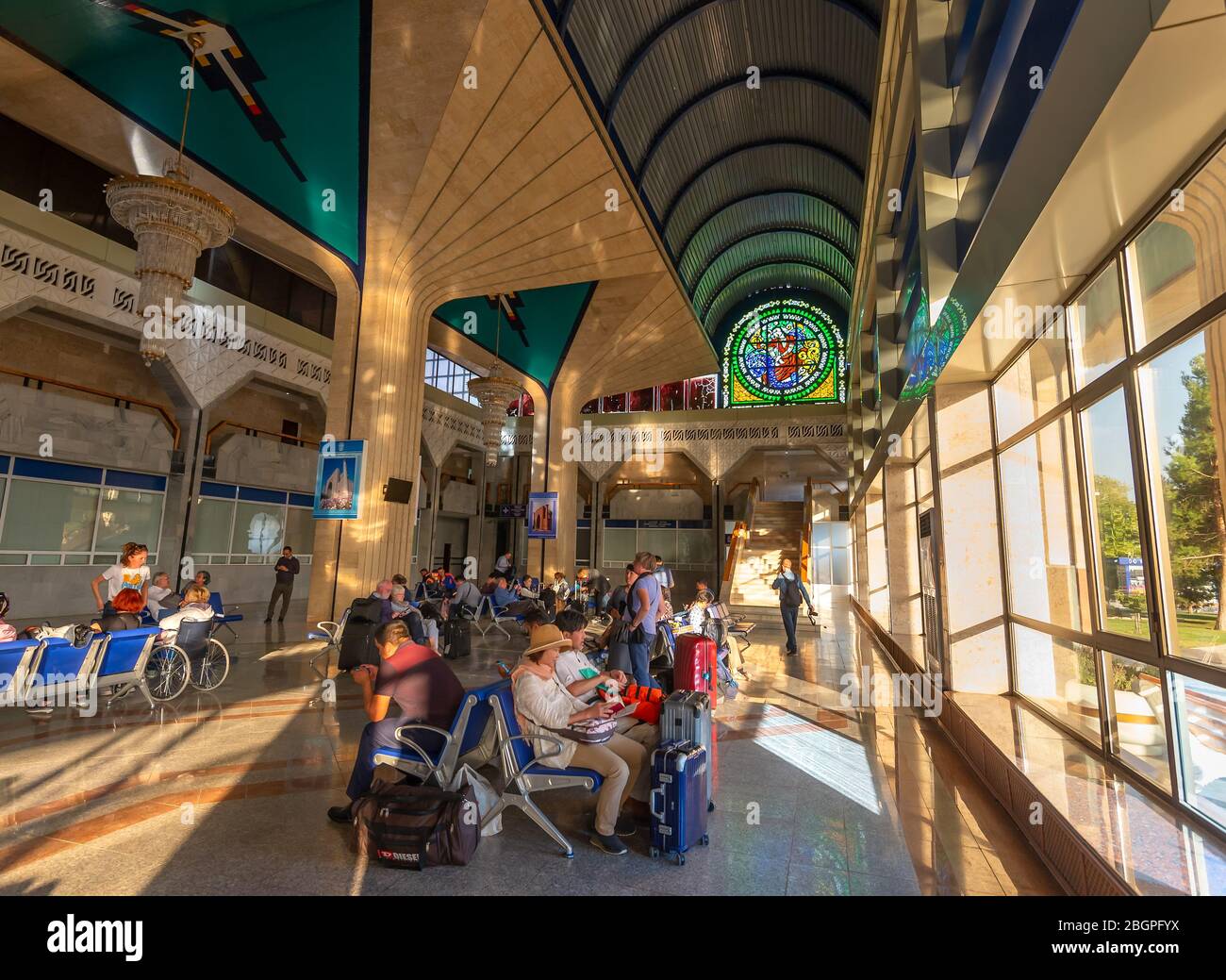 Interior of Samarkand train station. Passengers waiting for the ...