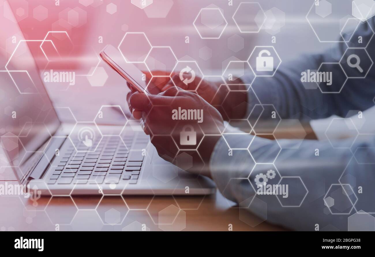 Black hacker holding phone with virtual display server data Stock Photo ...