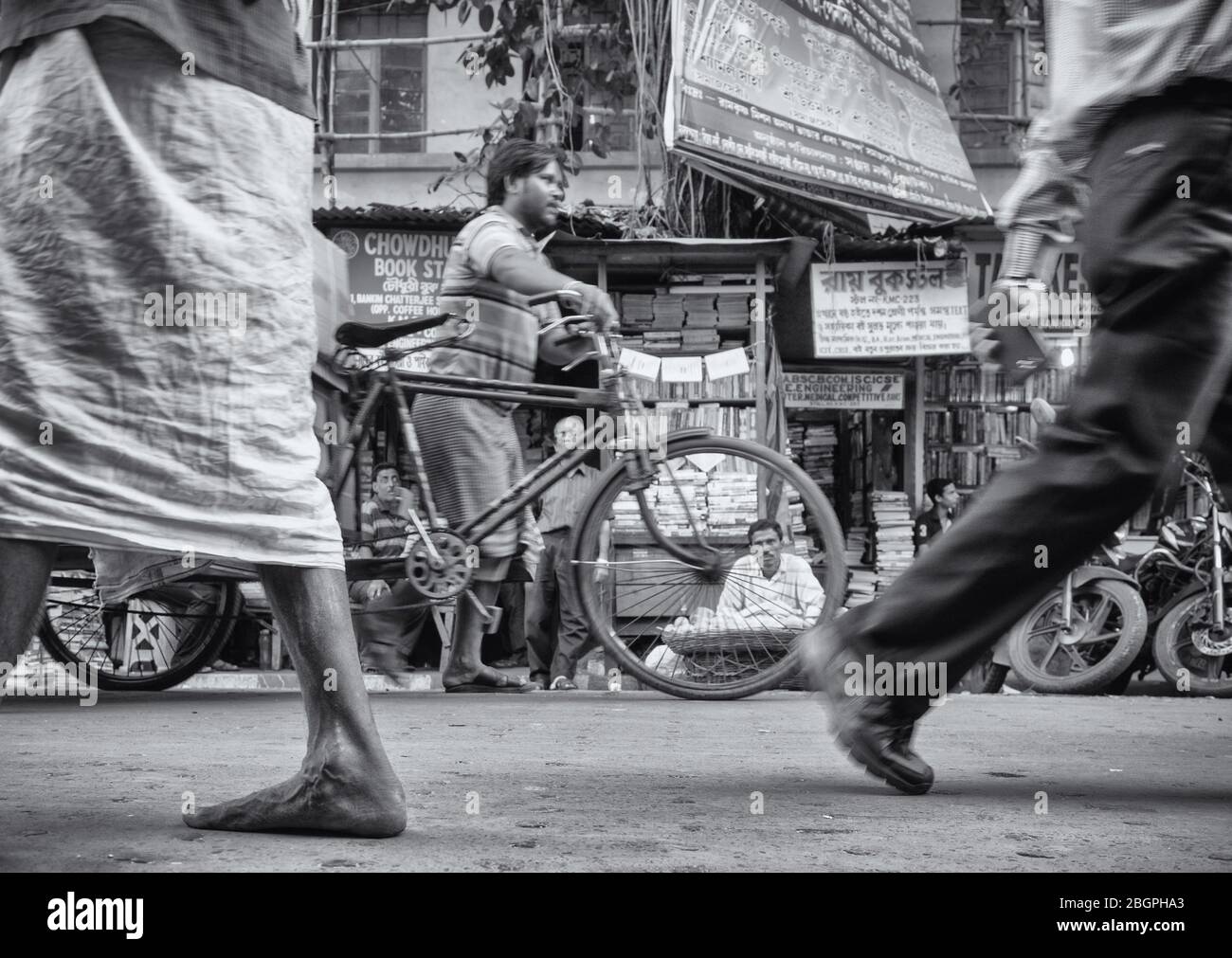 Street photography showing legs, feet, street vendors and transport in ...