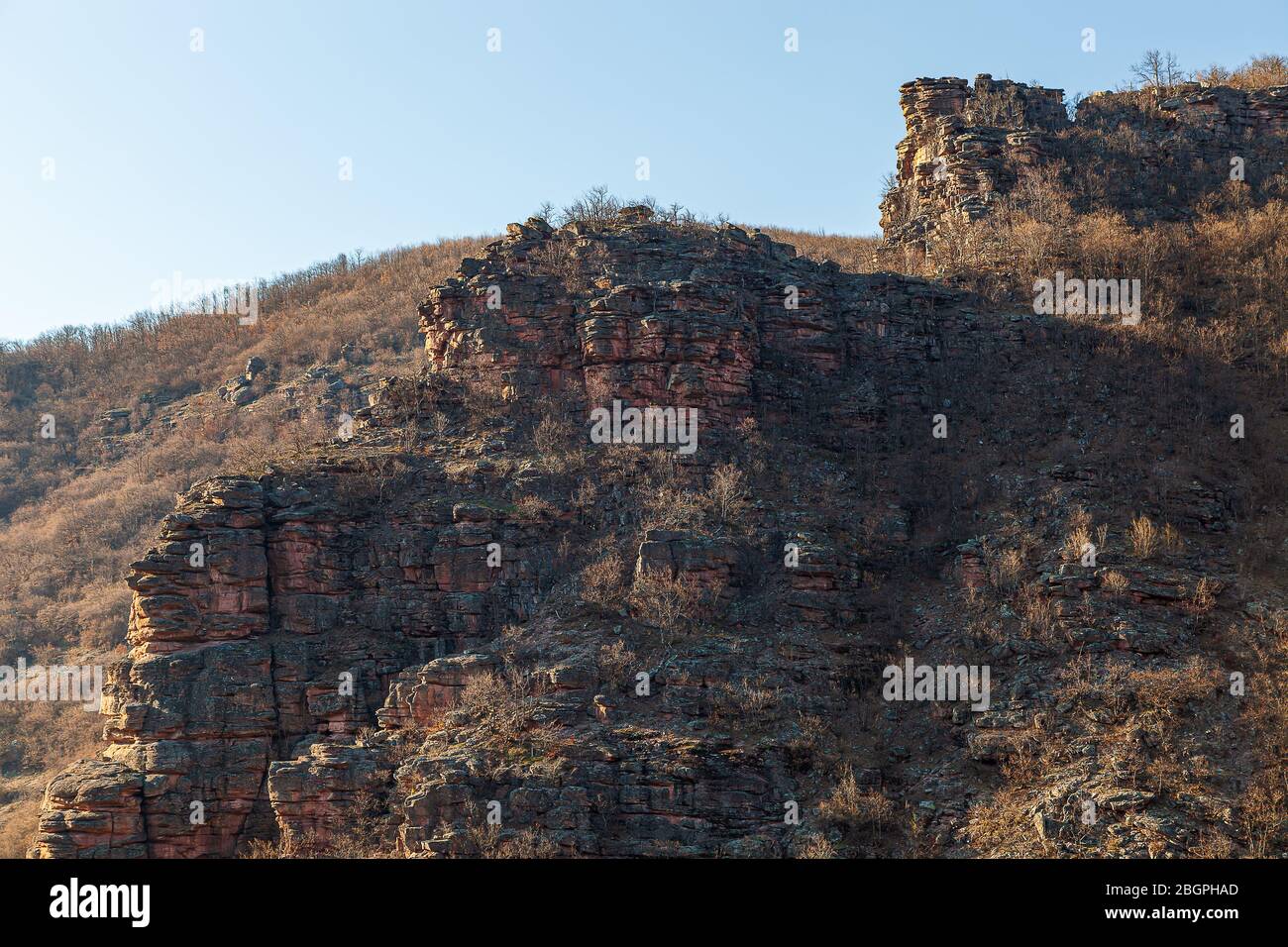 Beautiful shapes of eroded red rocks on impressive mountain peaks ...