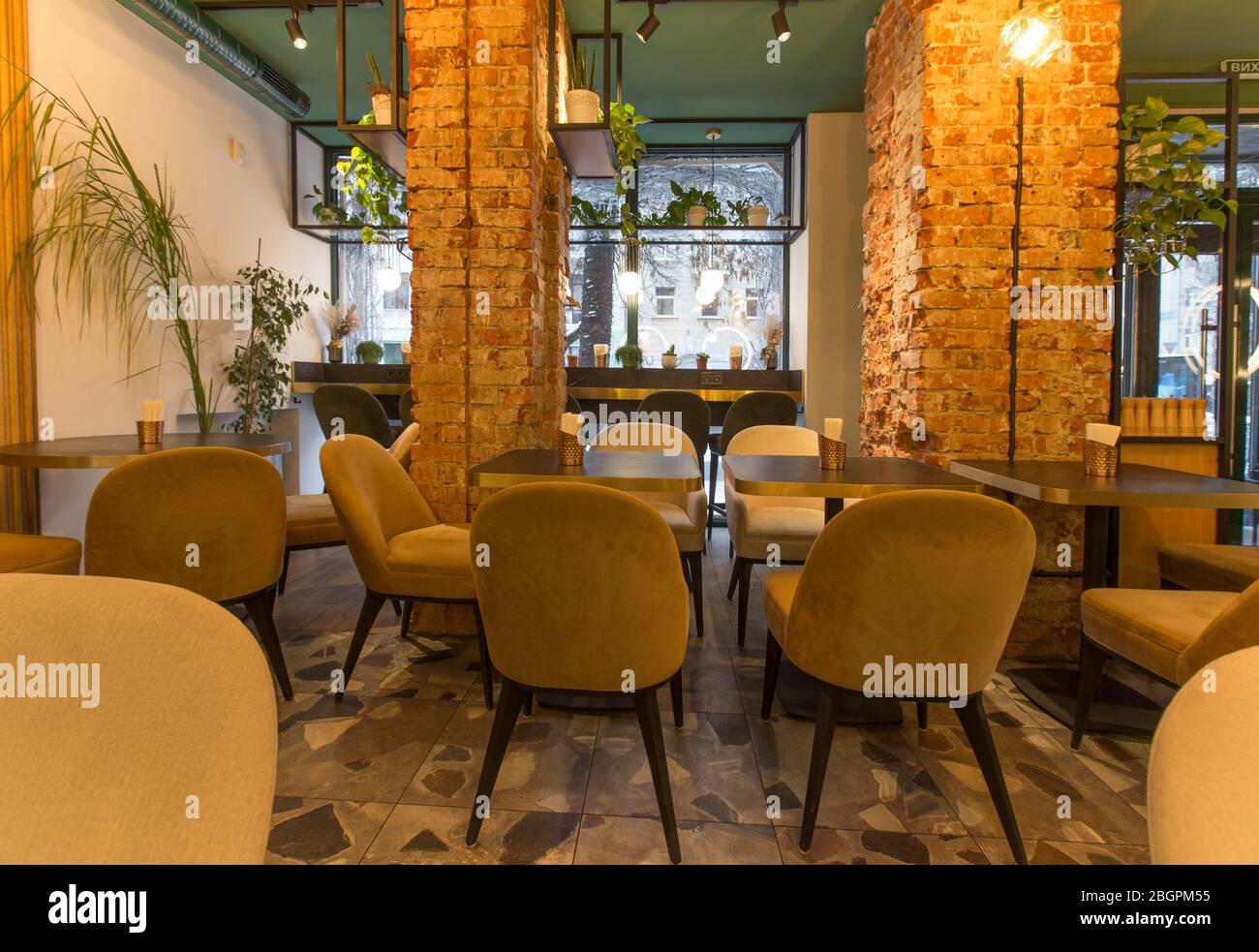 Cute restaurant interior with sofas and wooden tables Stock Photo - Alamy