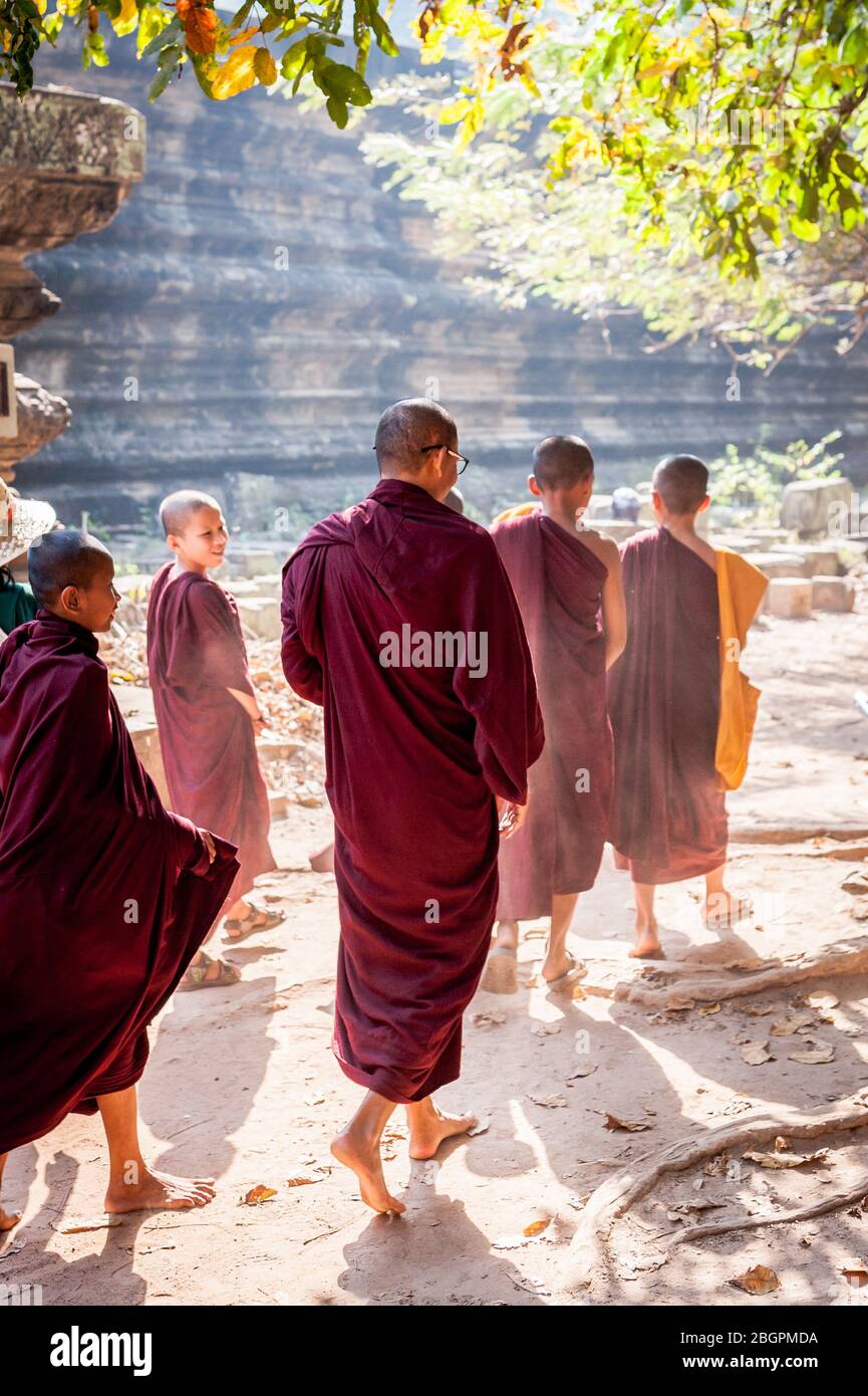 Young Cambodian monks walk through the incredible temples of Angkor Wat ...