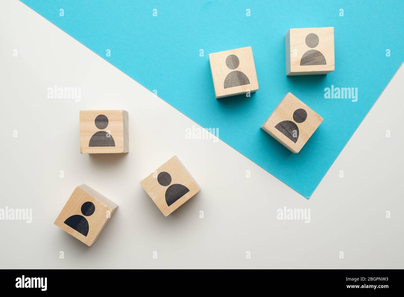 Team competition concept at work with icons on wooden blocks. Close up ...