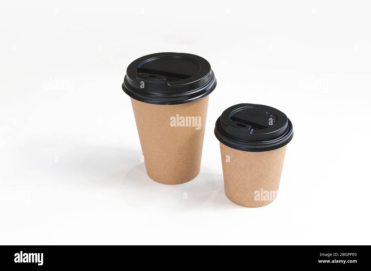 Craft coffee cups with paper on bright background. Eco friendly design ...