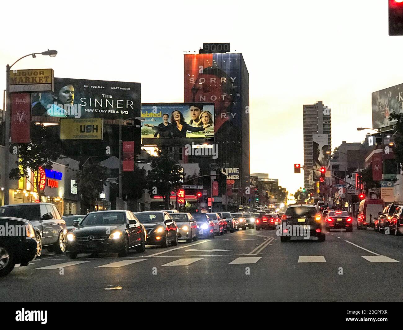 Driving on the Sunset Strip at night with billboards promoting movies ...